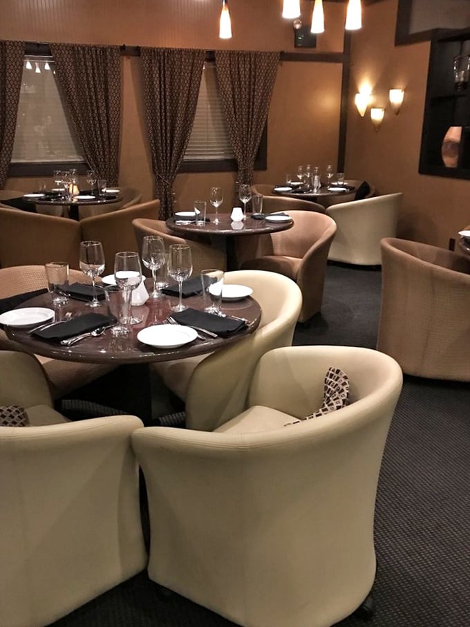 These cream-colored chairs aren't just seating&mdash;they're your supportive companions for the evening's flavor journey. The intimate lighting transforms everyone into their most photogenic selves.