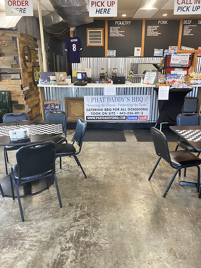 Inside, the corrugated metal counter and Ravens jersey tell you everything: this is Maryland barbecue territory where football and smoke-kissed meat form a perfect union.