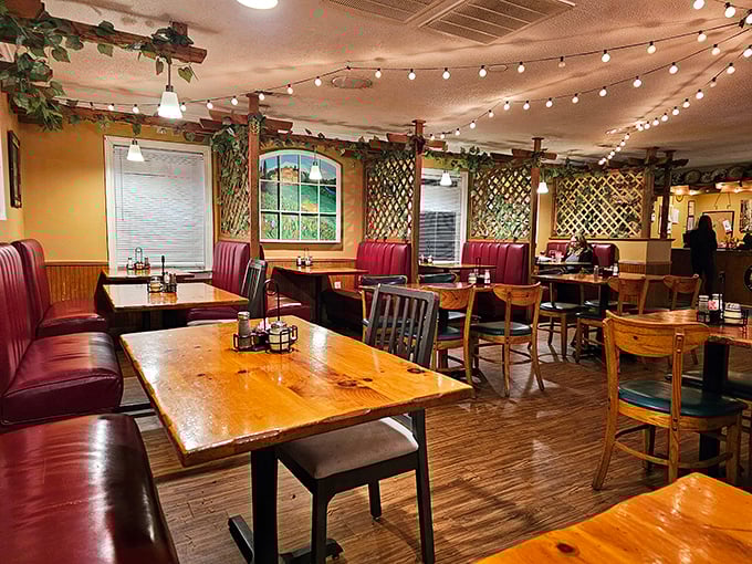 Red booths, wooden tables, and string lights create that magical Italian restaurant atmosphere where calories don't count and conversations flow like wine.