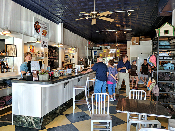 Inside, the classic black and white checkered floor and pressed tin ceiling create the perfect backdrop for ice cream memories in the making.