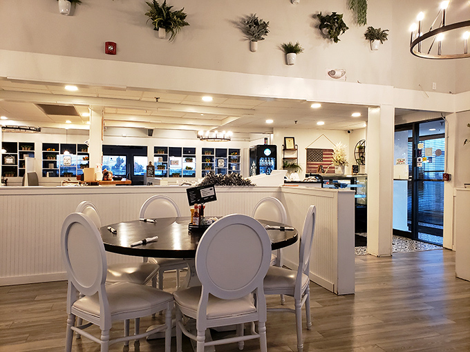 Clean lines, elegant white chairs, and hanging plants create an atmosphere that says "stay awhile" &ndash; breakfast shouldn't be rushed when it's this good.