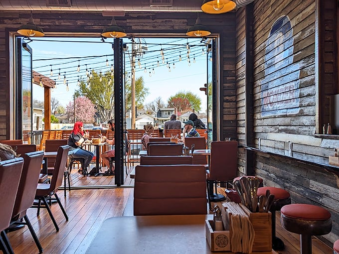 Rustic wooden walls meet modern comfort inside, where string lights create that perfect "I could stay here all day" ambiance. Morning sunshine streams through those generous windows.