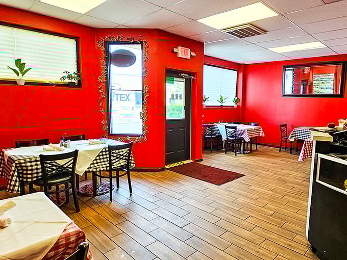 Step inside and the vibrant red walls embrace you like a warm Italian hug. Classic checkered tablecloths announce: serious comfort food ahead!