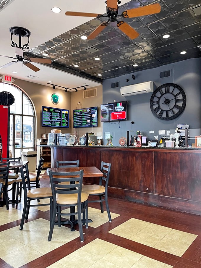 Inside, the decorative tin ceiling tiles and warm wooden accents create that perfect sweet spot between casual eatery and serious sandwich shrine.