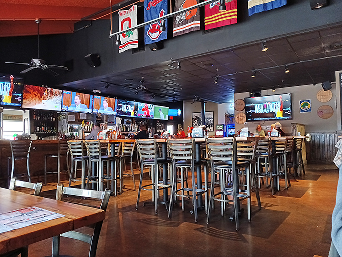 Where sports fans and food lovers unite under a canopy of team pennants. The bar stools have heard a thousand victory cheers and heartbreak sighs.