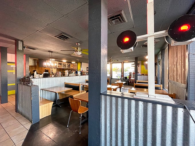Railroad-themed decor with corrugated metal and signal lights creates an atmosphere that's equal parts nostalgic and cozy. All aboard for flavor!