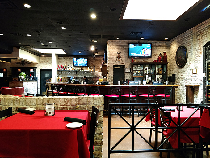 Red tablecloths and exposed brick create that perfect "fancy but comfortable" vibe where both date night and Tuesday takeout feel equally at home.