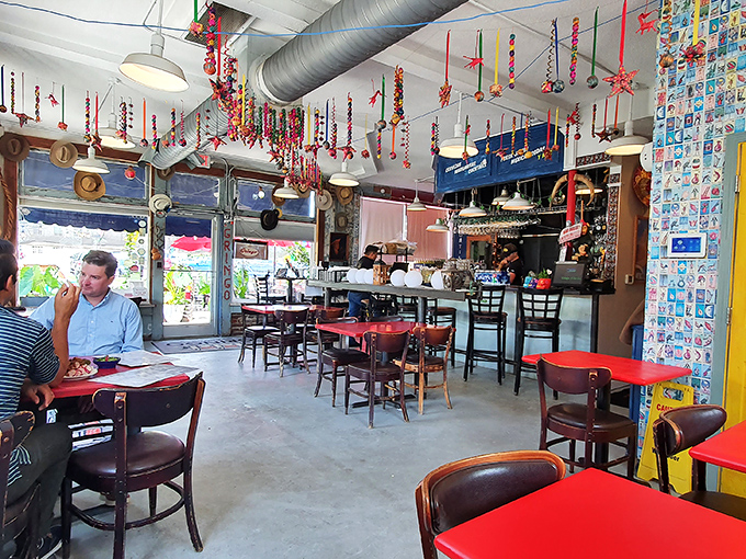 Colorful papel picado dangles from industrial ductwork, a perfect metaphor for this place&mdash;serious about food, but never about itself.