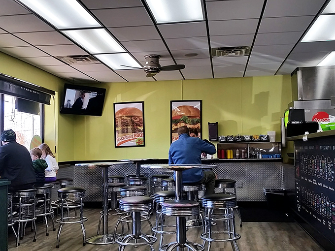 Chrome bar stools and lime green walls create a no-nonsense burger sanctuary. This isn't where you come for ambiance&mdash;it's where you come when your stomach is making executive decisions.