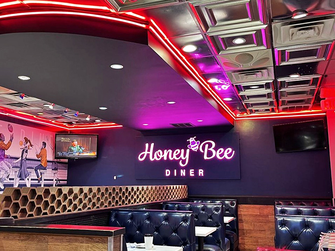 Step inside and the diner's honeycomb-patterned details and vibrant neon lighting create an atmosphere that's both nostalgic and thoroughly modern.