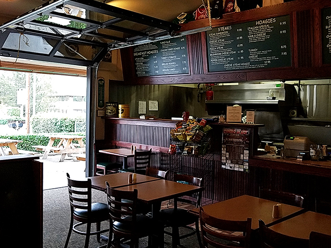 Simple tables, wooden accents, and an atmosphere that says "we're here for the food, not the frills." This is sandwich zen at its finest.