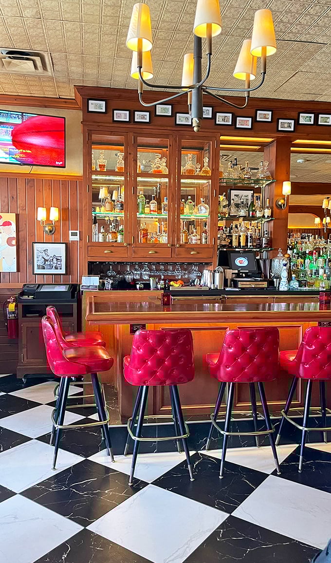 The bar at The Avenue isn't just gorgeous&mdash;those red leather stools are practically begging you to settle in for a Manhattan and life-changing conversation.