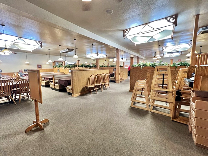 Wooden booths and warm lighting create that "grandma's dining room expanded for the whole county" vibe. Comfort begins before the first bite.