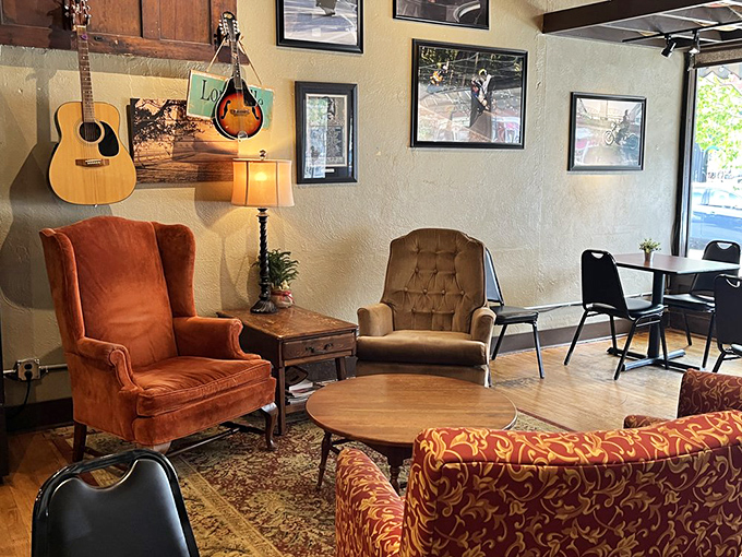 Vintage armchairs and acoustic instruments create a living room vibe that says, "Stay awhile, your emails can wait another hour."