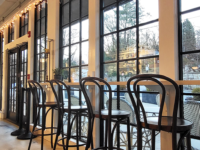 Where sunshine meets pastry magic. Tall windows flood the space with natural light while bistro seating creates the perfect perch for people-watching between bites.