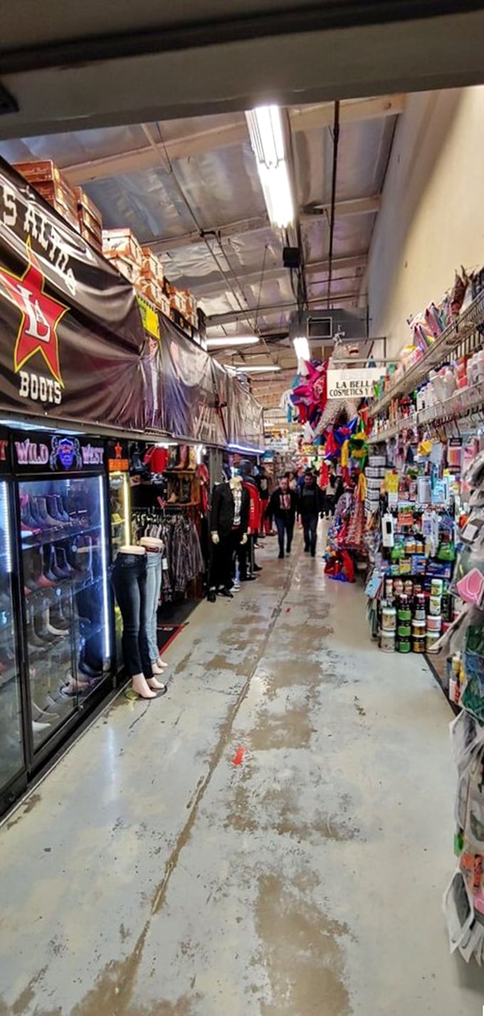 Narrow pathways lined with merchandise create a labyrinth of discovery. Every turn reveals new possibilities in this indoor bazaar of wonders.