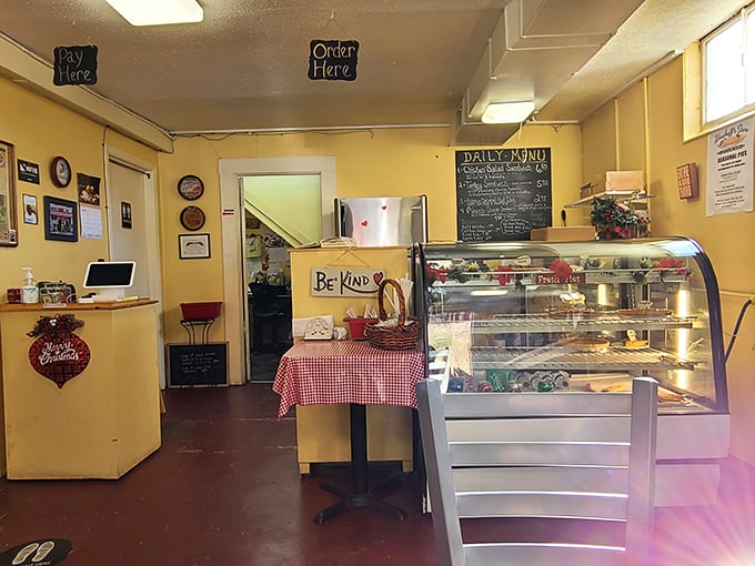 Inside, yellow walls create perpetual sunshine while the "Be Kind" sign reminds you of the philosophy that seems baked into everything at Woodruff's.