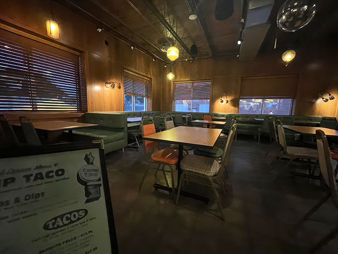Cozy booths, warm wood paneling, and pendant lighting create the perfect backdrop for taco-fueled conversations. It's like dining in the world's most delicious cabin.
