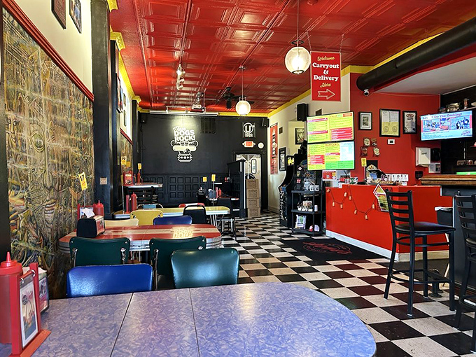 The classic checkerboard floor and vibrant red ceiling set the stage for hot dog artistry. This isn't just decoration&mdash;it's a declaration of personality.