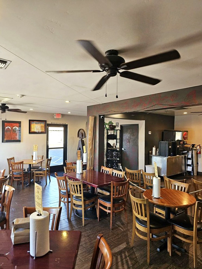 Simple wooden tables, ceiling fans, and Native American artwork create an unpretentious atmosphere where the food, not the decor, takes center stage.