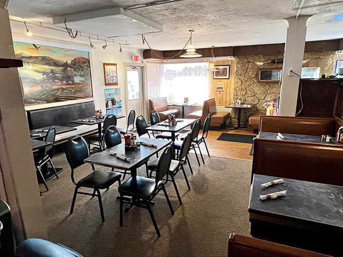 Classic steakhouse ambiance with stone walls and simple furnishings&mdash;proof that great food doesn't need fancy surroundings to shine.