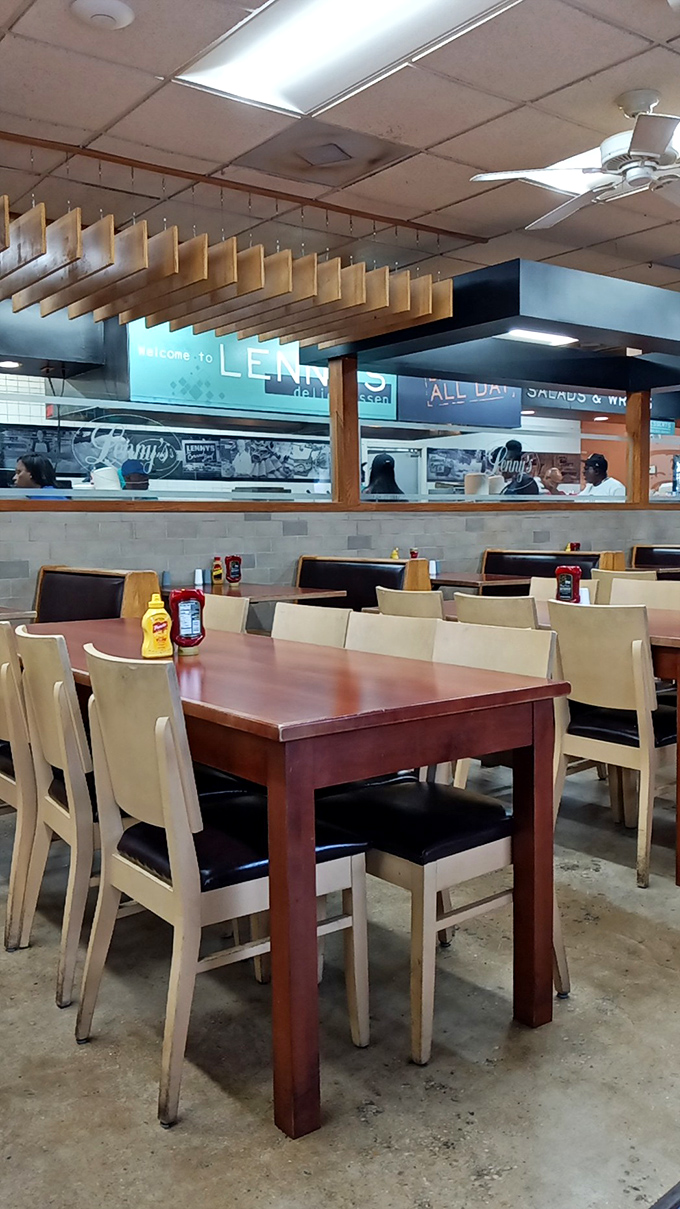 Where sandwich dreams come true: Lenny's interior combines no-nonsense functionality with that unmistakable deli energy. The mustard and ketchup stand ready for duty.