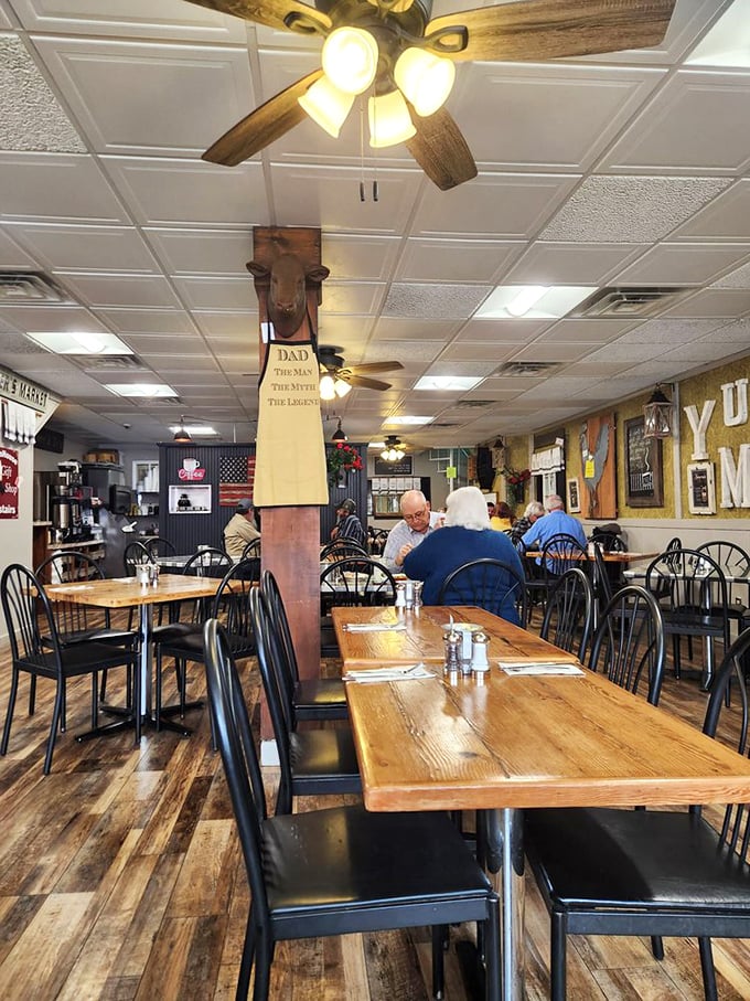Wooden tables worn smooth from decades of happy elbows tell stories of countless meals shared in this homey dining room.