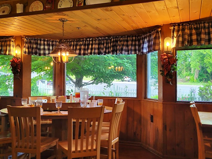 Wooden paneling and blue checkered curtains create the perfect backdrop for comfort food conversations that have spanned generations.
