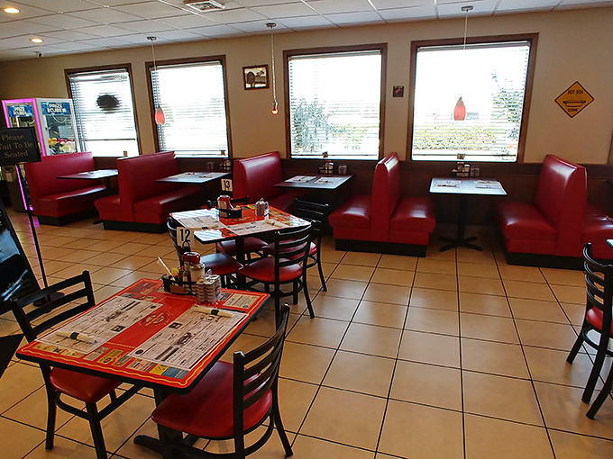 Red vinyl booths await hungry patrons like front-row seats to a flavor concert. This isn't fancy dining; it's fantastic dining.