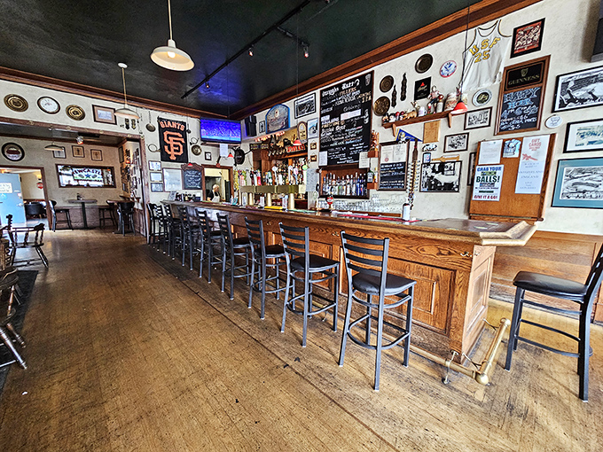 Inside, time slows down as the worn wooden bar and memorabilia-covered walls tell stories of pints past and friendships forged over comfort food.