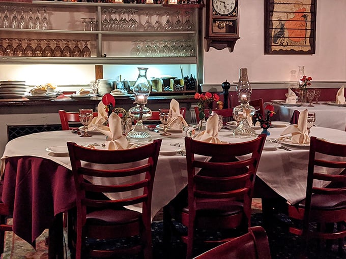 Elegant yet unpretentious, the dining room's burgundy and white color scheme creates the perfect backdrop for memorable meals and meaningful conversations. 