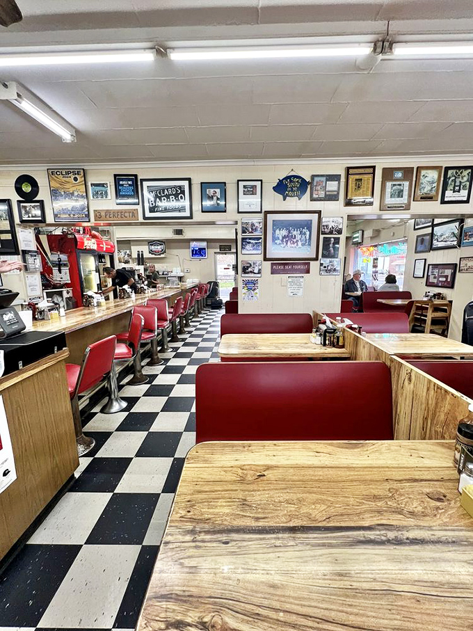 Classic red vinyl booths, checkered floors, and walls of memorabilia&mdash;McClard's interior is a time capsule where barbecue history lives and breathes.