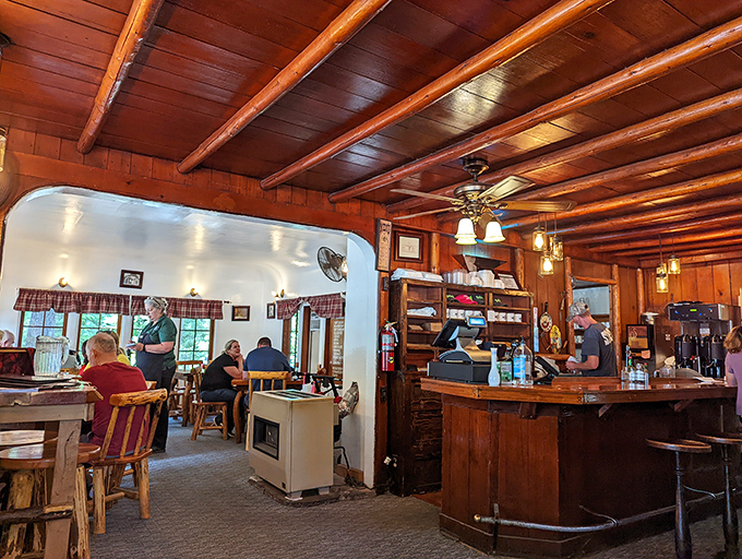 The warm wood-paneled interior feels like dining in a cozy mountain lodge, where every beam tells a story of Oregon's timber heritage.