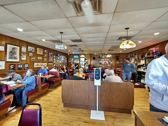 Red vinyl booths and wood-paneled walls create the perfect backdrop for conversations that flow as freely as the coffee. 