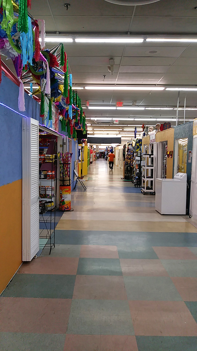 Colorful streamers hang like festive flags above a maze of vendor stalls, where each corridor leads to potential discoveries and unexpected finds.