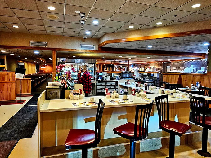 Cozy booths and warm wood paneling create that perfect nostalgic diner atmosphere where comfort is always on the menu