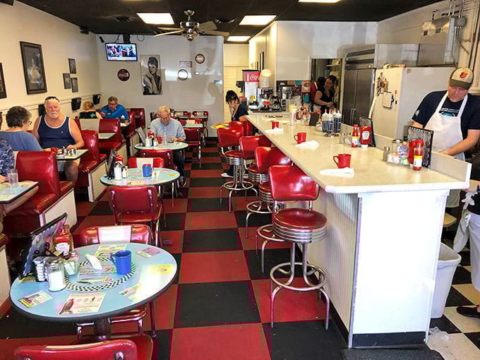 Red vinyl booths, checkerboard floors, and counter seating straight from 1955. This isn't retro by design&mdash;it's authentic by survival.