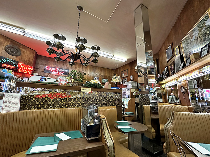 Step inside and suddenly it's 1965 again - wood paneling, vintage booths, and chandeliers that have illuminated generations of ice cream dreams.