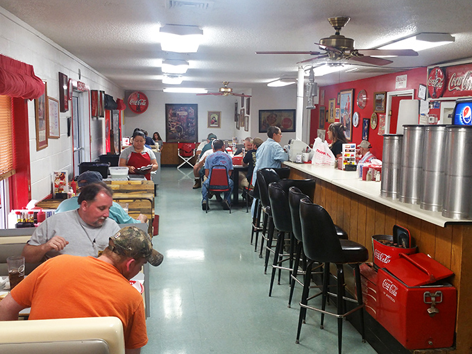 Inside, red vinyl booths and Coca-Cola memorabilia create that perfect time-capsule atmosphere where calories don't count and conversations flow freely.