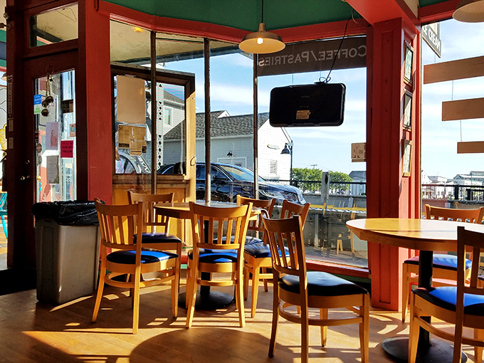 Sunlight streams through windows illuminating wooden tables where ice cream dreams come true. The best seat in the house? Any of them.