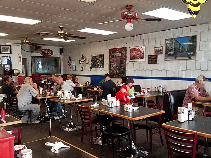 Red booths and wooden tables create that perfect diner atmosphere where conversations flow as freely as the coffee. 