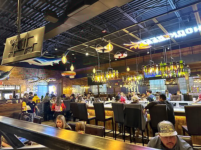 Warm wooden beams and ambient lighting create a cozy maritime atmosphere that says "yes, you can find great seafood 1,000 miles from any coast."