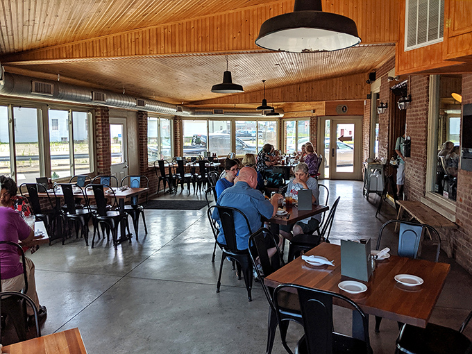 Inside, wooden ceilings and exposed brick create that perfect "rustic-meets-refined" atmosphere where you can focus on what matters: the meat marathon ahead.