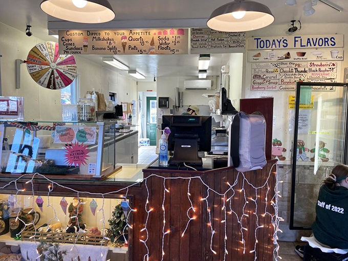 Inside this temple of frozen treasures, the counter gleams with possibility while the flavor board looms like a lottery of deliciousness waiting to be won.