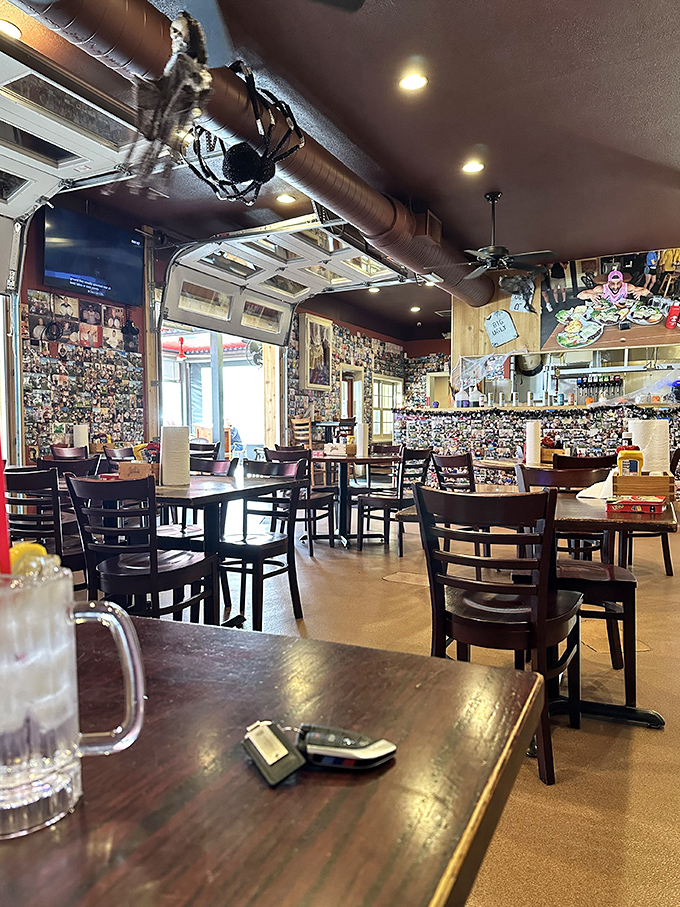Wall-to-wall victory photos tell the story: conquering the Big Ugly burger isn't just a meal, it's an achievement worthy of immortalization.