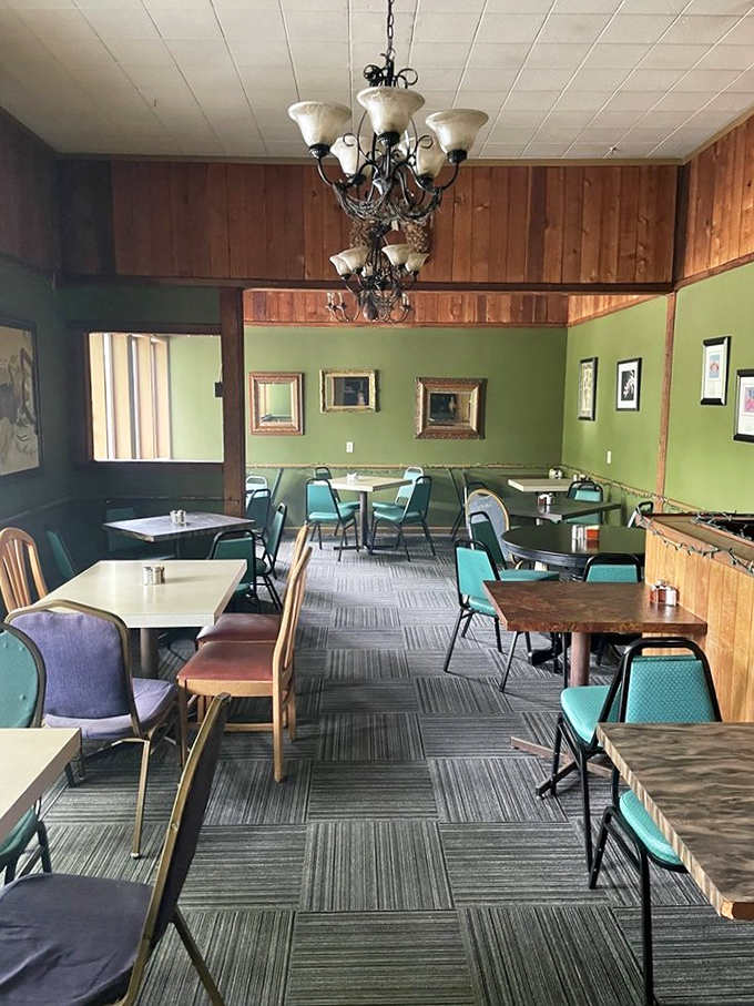 Mint green walls, wooden accents, and vintage chandeliers create that rare atmosphere that's both cozy and slightly elegant&mdash;like wearing good shoes with sweatpants.