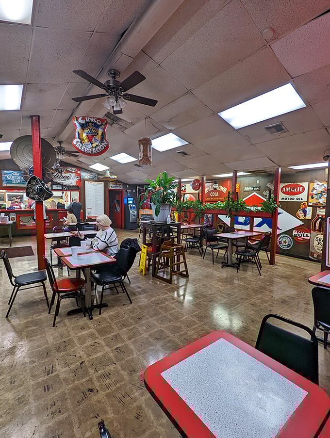 Inside Tacoville, vintage signs and simple decor create an atmosphere that says, "We're here for the food, not the frills."