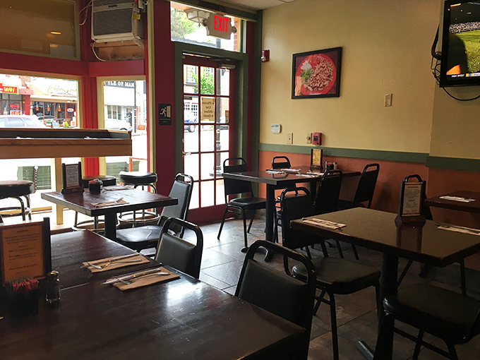 Lime green walls and exposed brick create a vibrant yet casual atmosphere where the focus remains squarely on what matters most—the food.