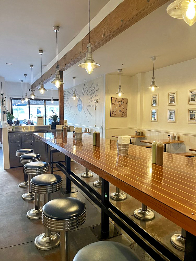 Nautical-inspired pendant lights illuminate the gleaming communal table where strangers become friends over shared burrito enthusiasm.