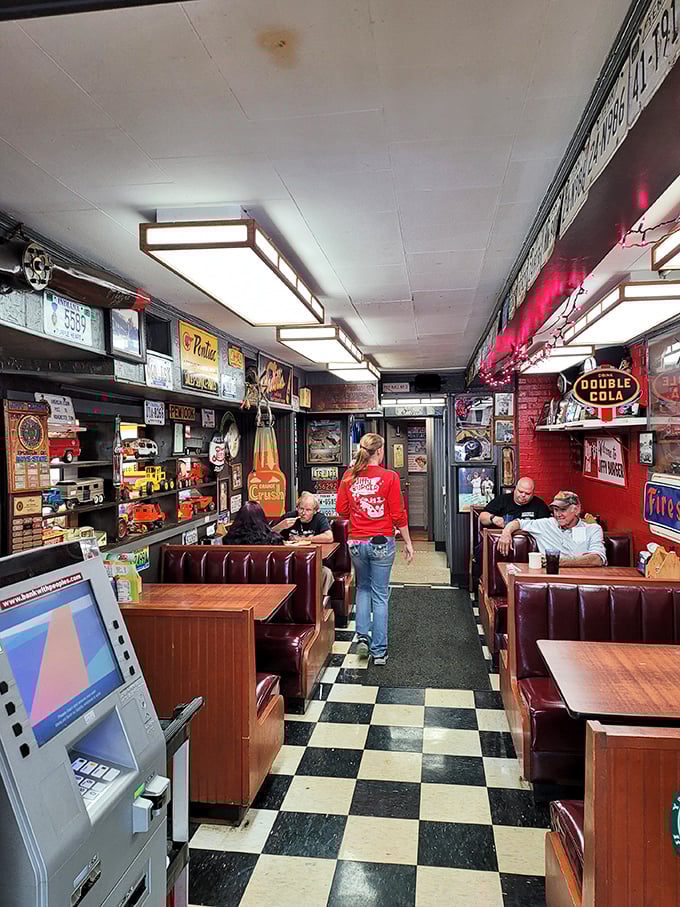 Step inside and the decades melt away. Classic checkerboard floors, vinyl booths, and walls plastered with memorabilia create the diner equivalent of a warm hug.